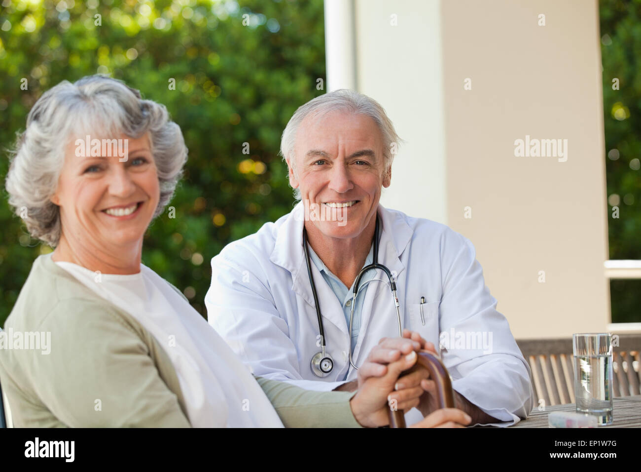 Senior doctor talking with his mature patient Stock Photo - Alamy