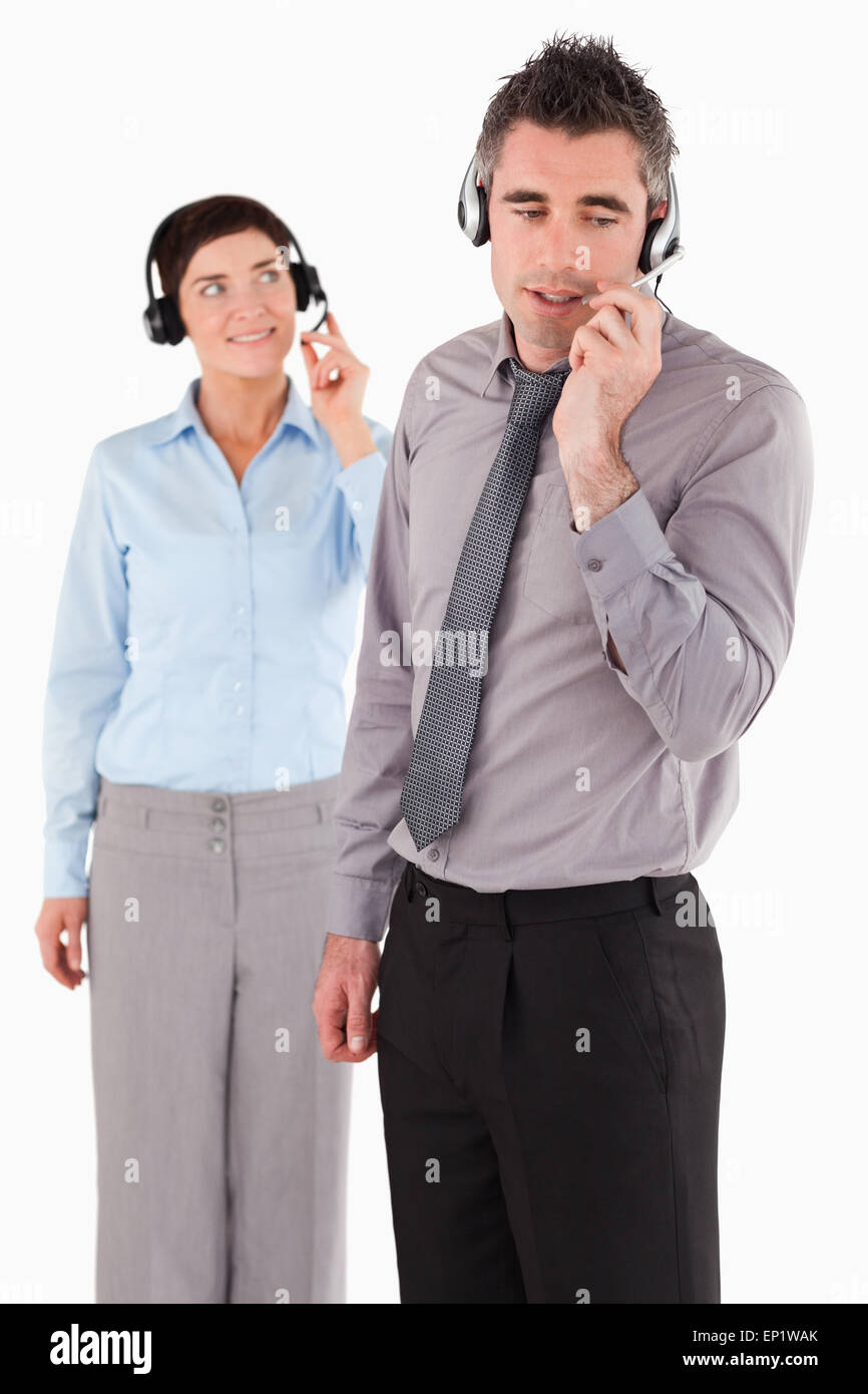 Portrait of office workers speaking through headsets Stock Photo - Alamy