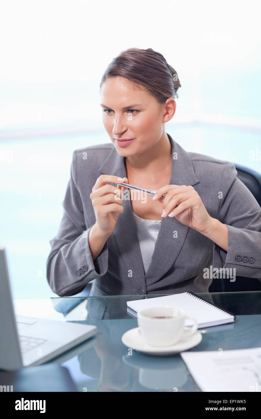 Portrait of a focused businesswoman taking notes Stock Photo - Alamy