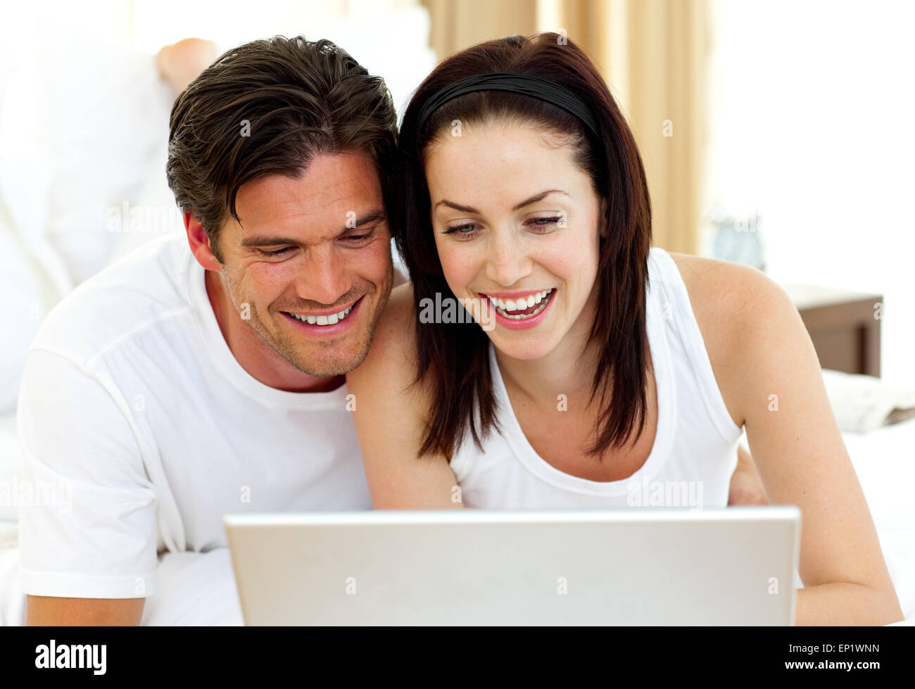 Romantic couple using laptop Stock Photo - Alamy