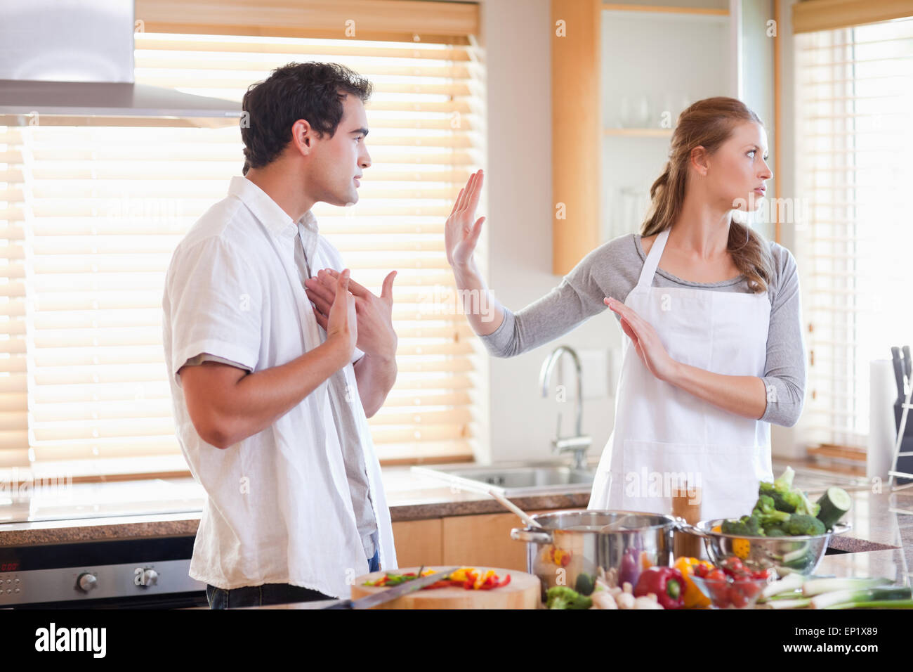 Couple arguing in the kitchen Stock Photo - Alamy