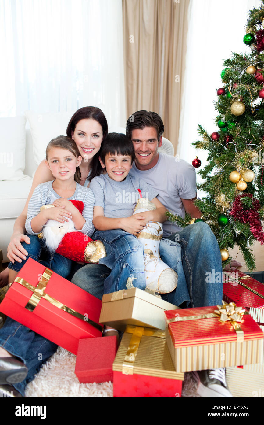 Happy family with lots of Christmas presents Stock Photo - Alamy