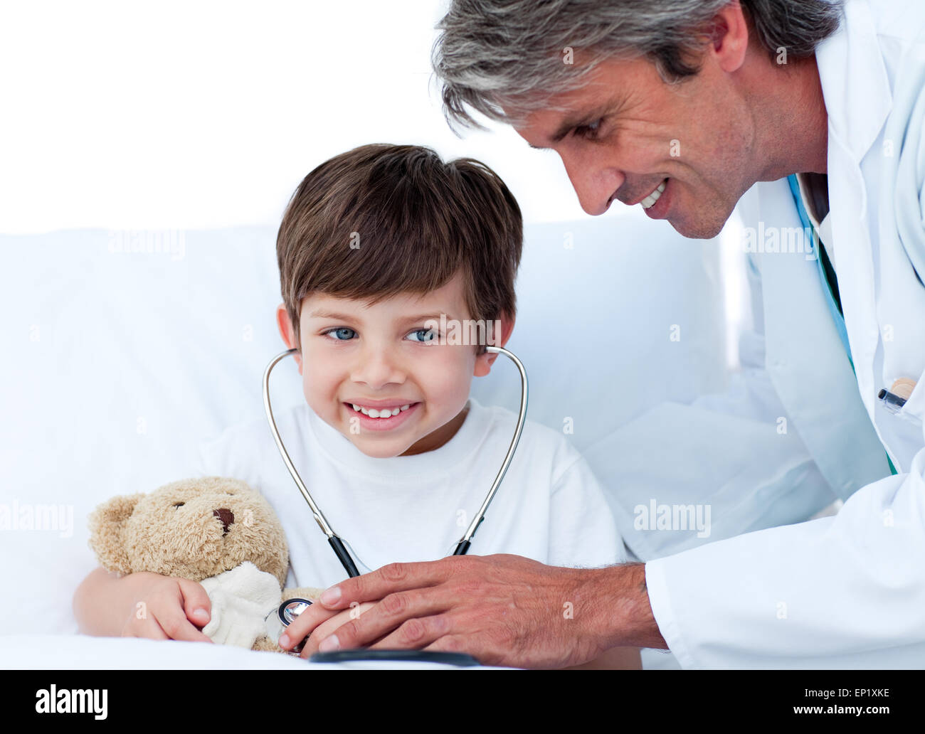 Cute Little boy playing with his doctor Stock Photo - Alamy
