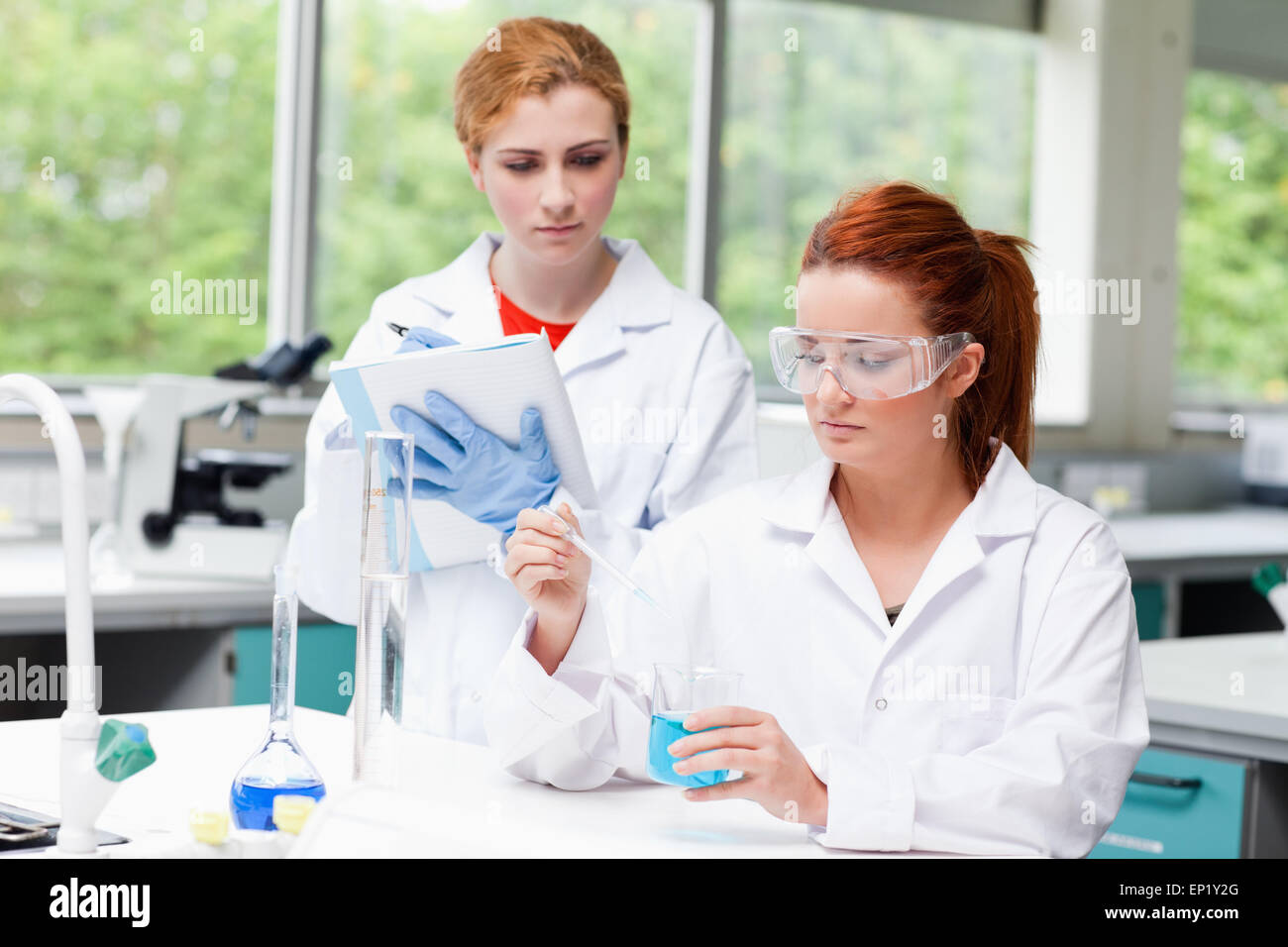 Young science students doing an experiment Stock Photo - Alamy