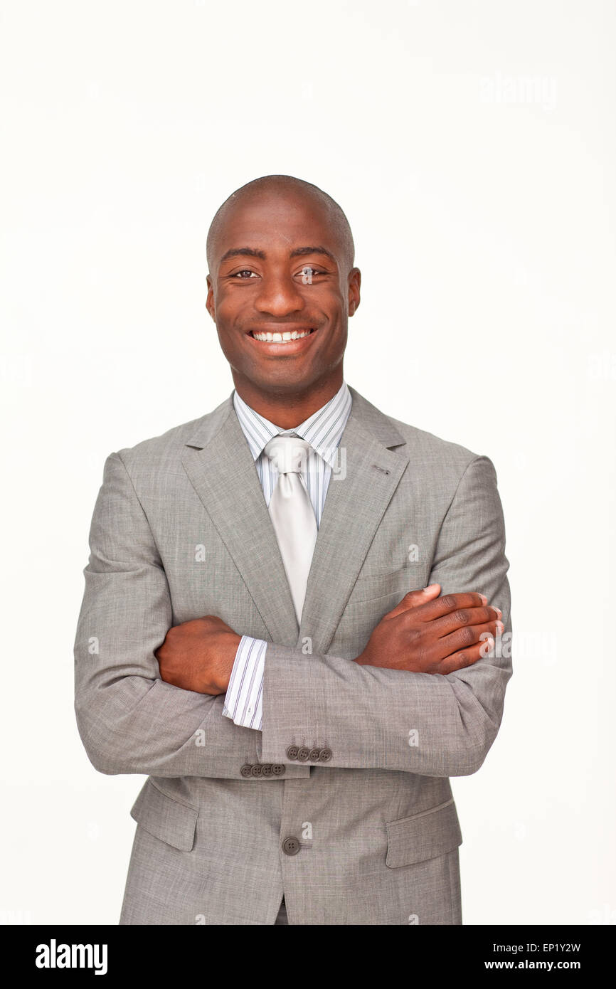 Smiling Afro-American businessman with folded arms against white background Stock Photo - Alamy