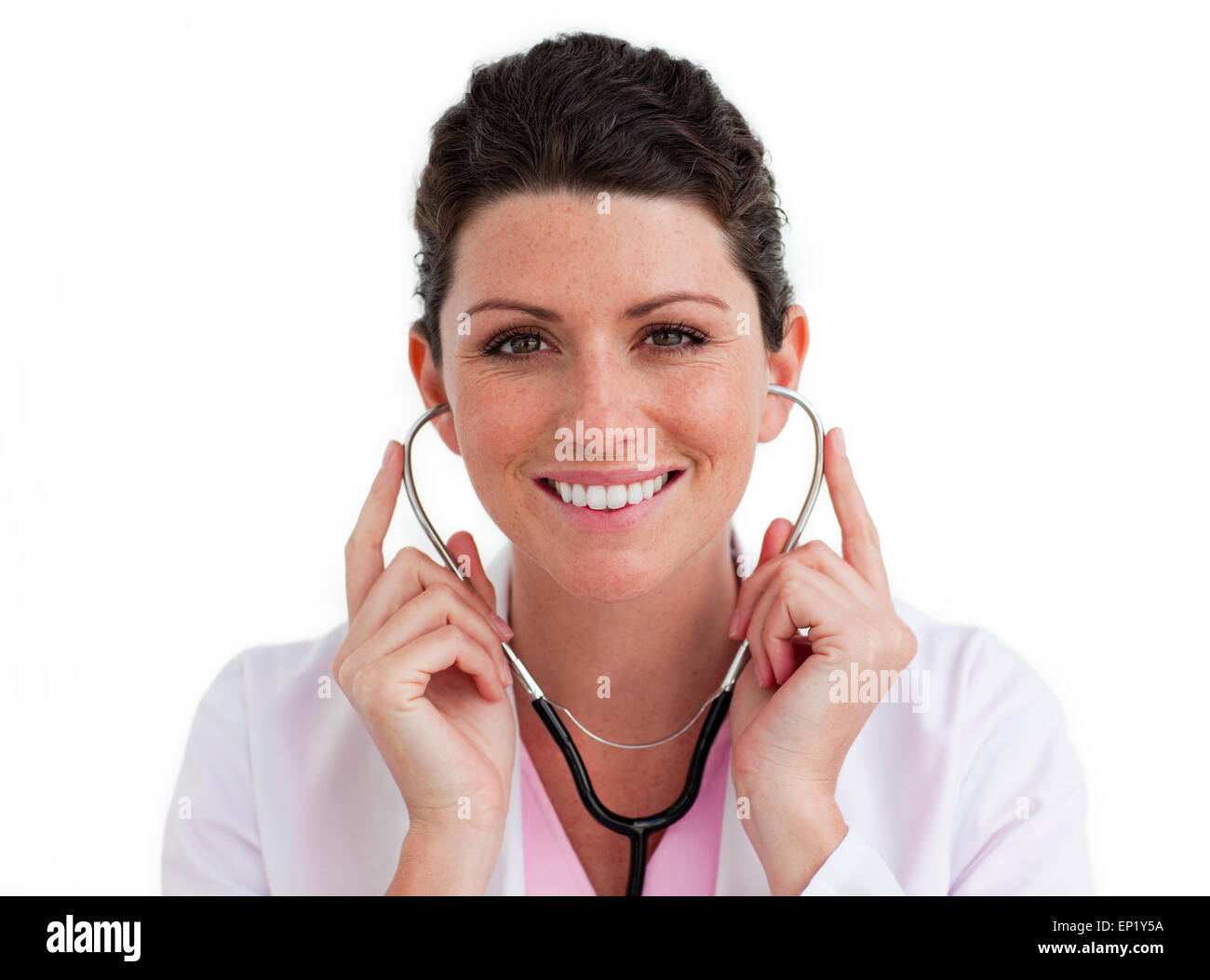 Portrait of a nurse holding a stethoscope against a white background ...