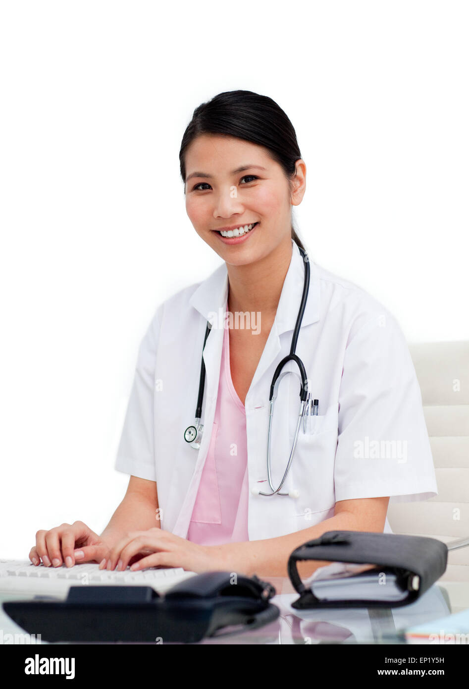 Female doctor working on computer against a white background Stock ...