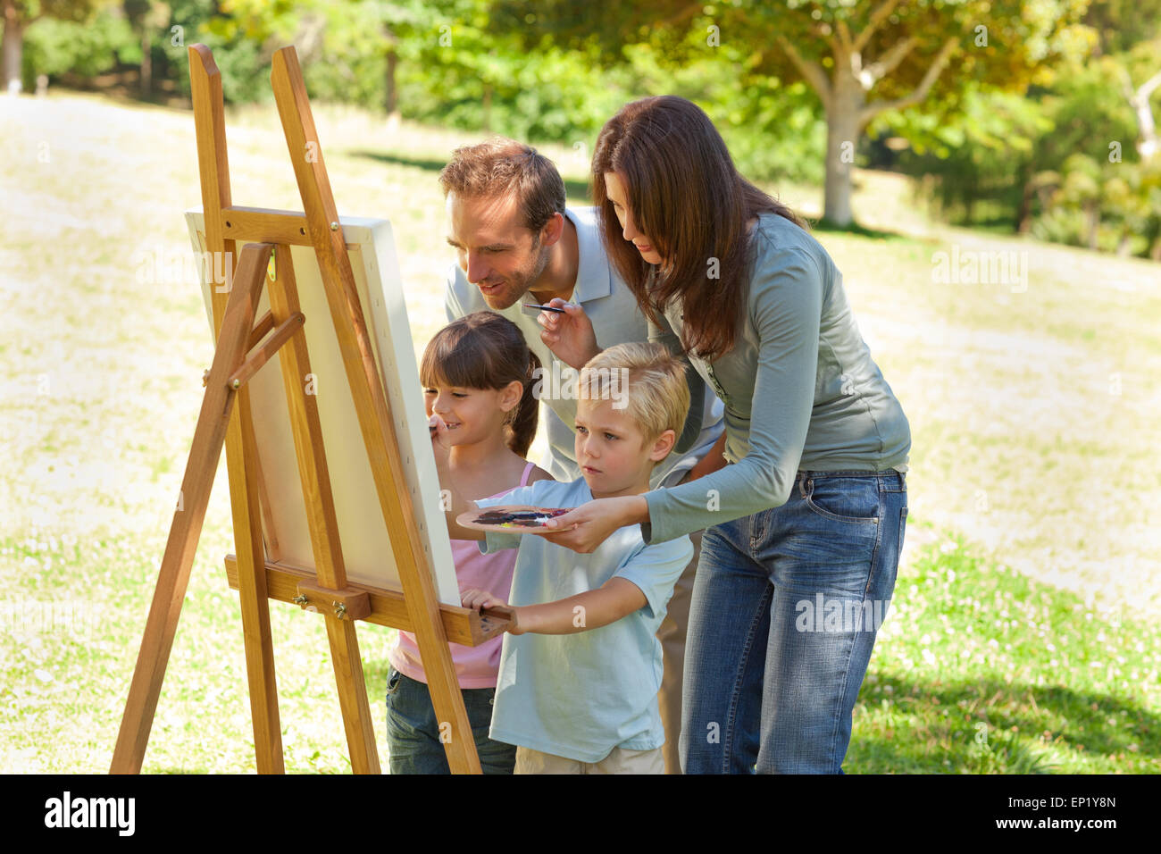 Family painting together in the park Stock Photo - Alamy