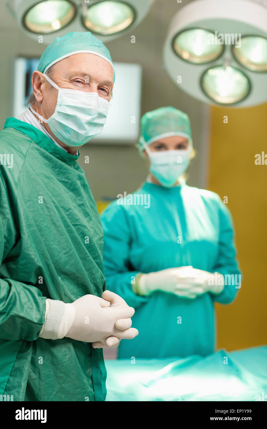 Two surgeon crossing their hands while standing Stock Photo - Alamy