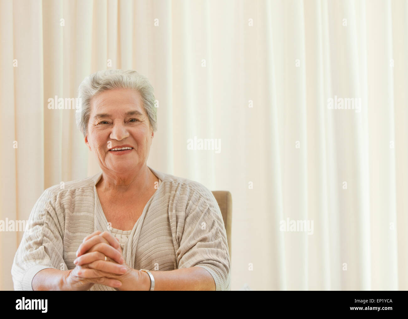 Radiant woman looking at the camera Stock Photo - Alamy