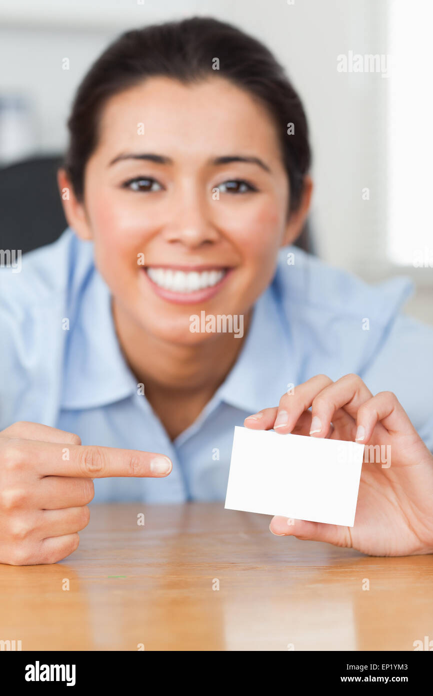 Charming woman showing her visiting card Stock Photo - Alamy