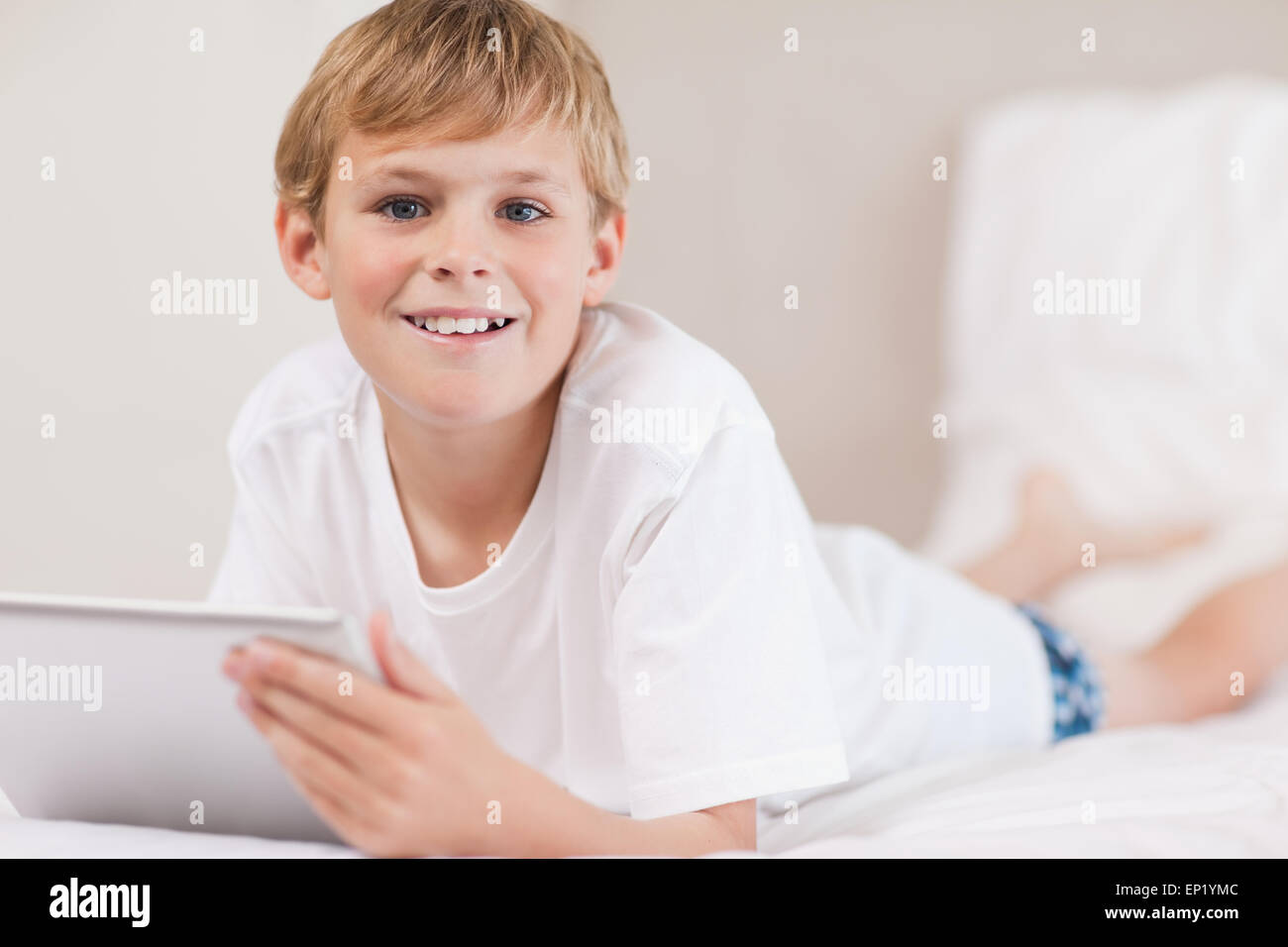 Boy using a tablet computer Stock Photo - Alamy