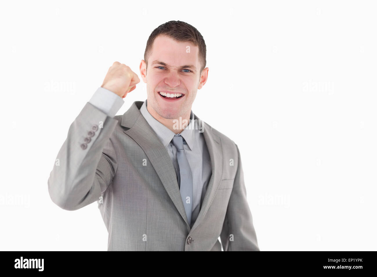 Businessman with his fist up Stock Photo - Alamy