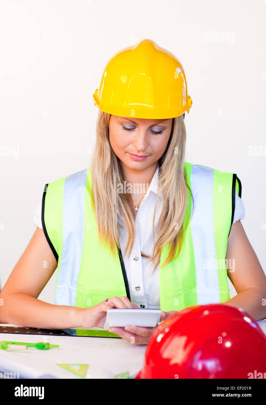 Female with hard hat working Stock Photo - Alamy