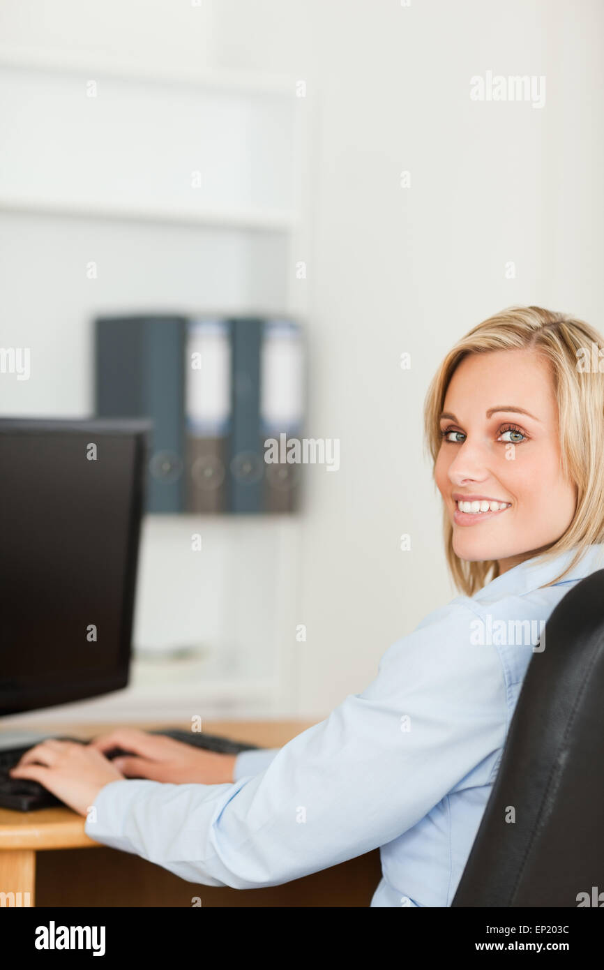 Young businesswoman smiling into camera Stock Photo - Alamy