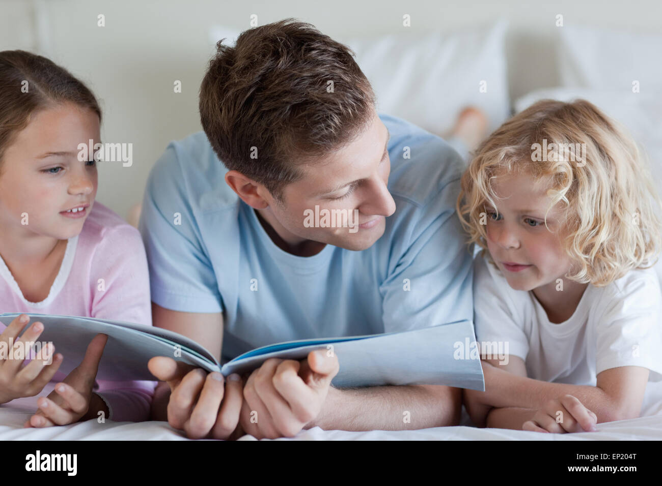 Father reading with his children Stock Photo - Alamy