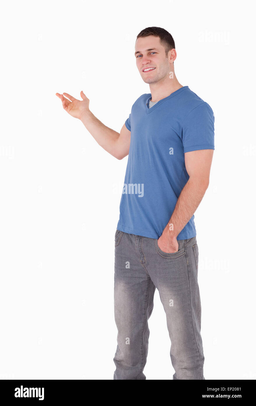 Portrait of a smiling man showing something Stock Photo - Alamy