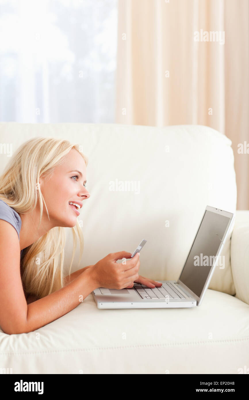 Portrait of a beautiful woman purchasing online Stock Photo - Alamy