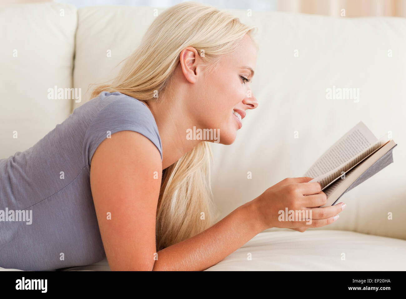 Cute woman reading a book Stock Photo - Alamy