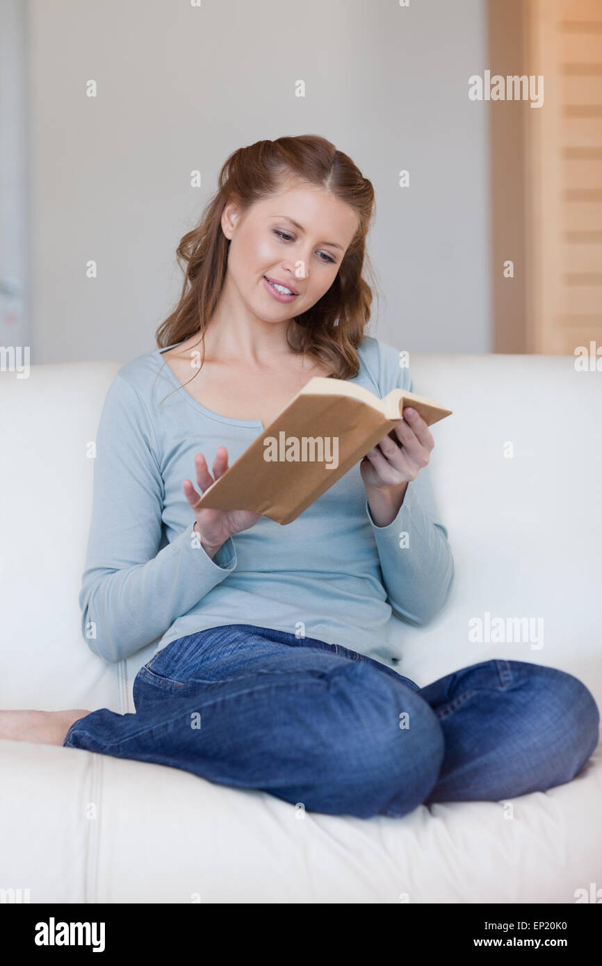 Woman turning page of her book Stock Photo - Alamy