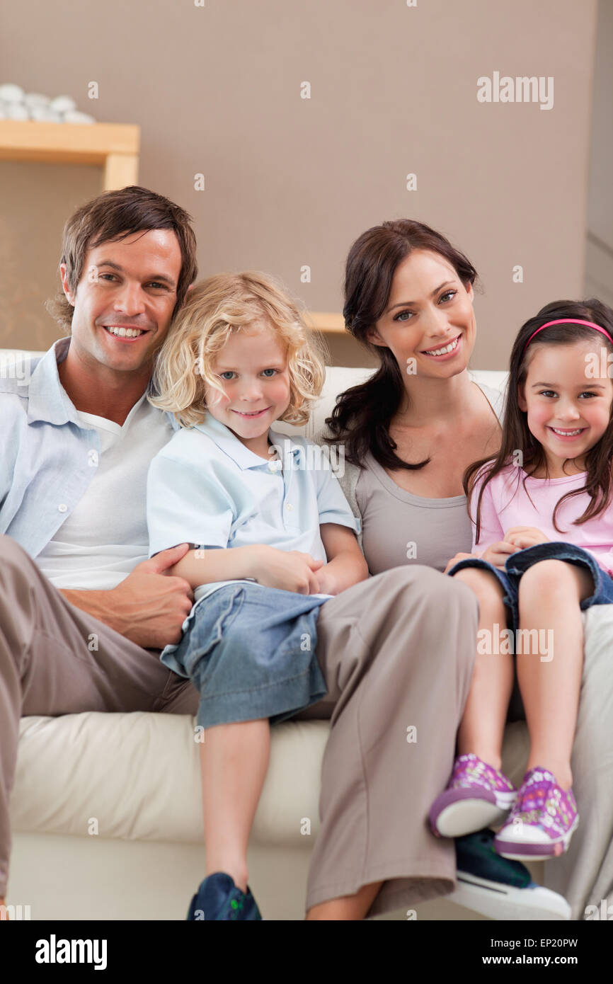 Portrait of a family watching television together Stock Photo - Alamy
