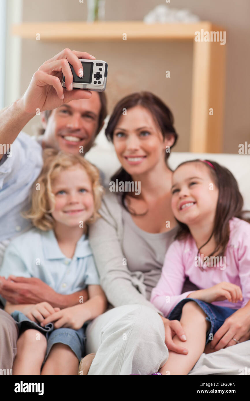 Portrait of a father taking a picture of his family Stock Photo - Alamy