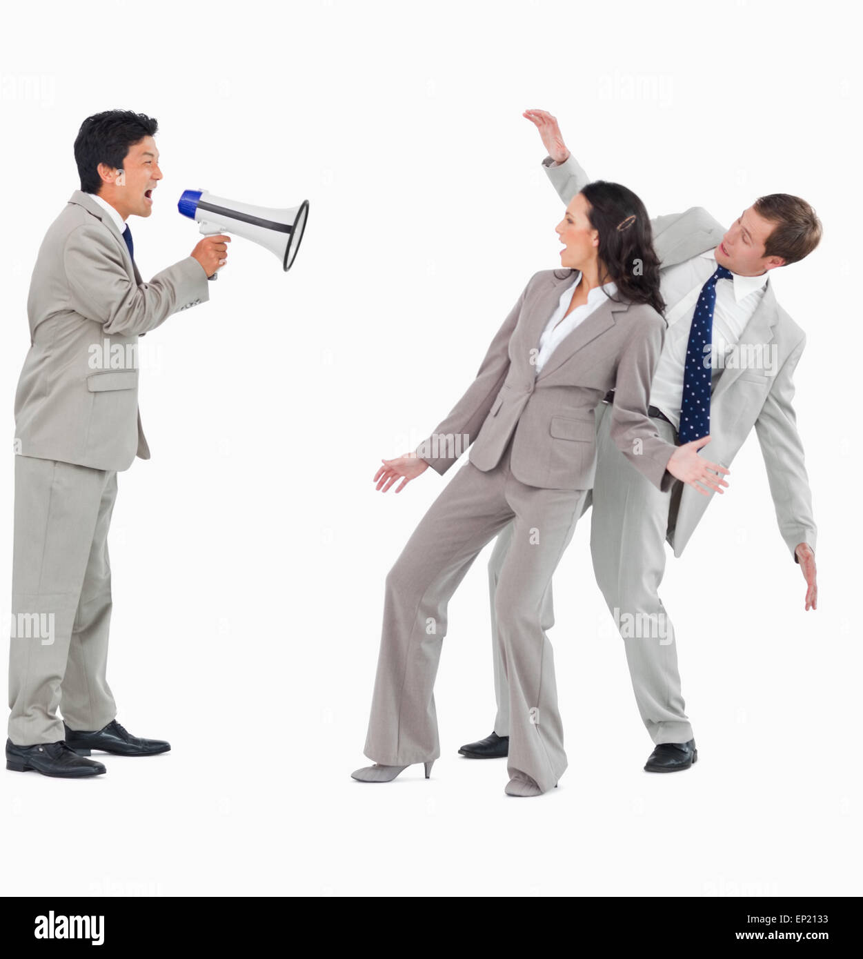 Businessman with megaphone shouting at colleagues Stock Photo - Alamy