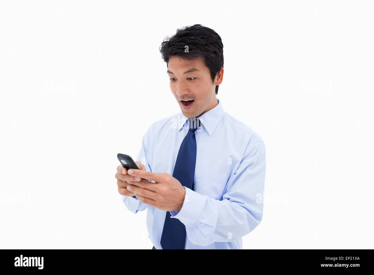 Surprised business man reading a text message Stock Photo - Alamy