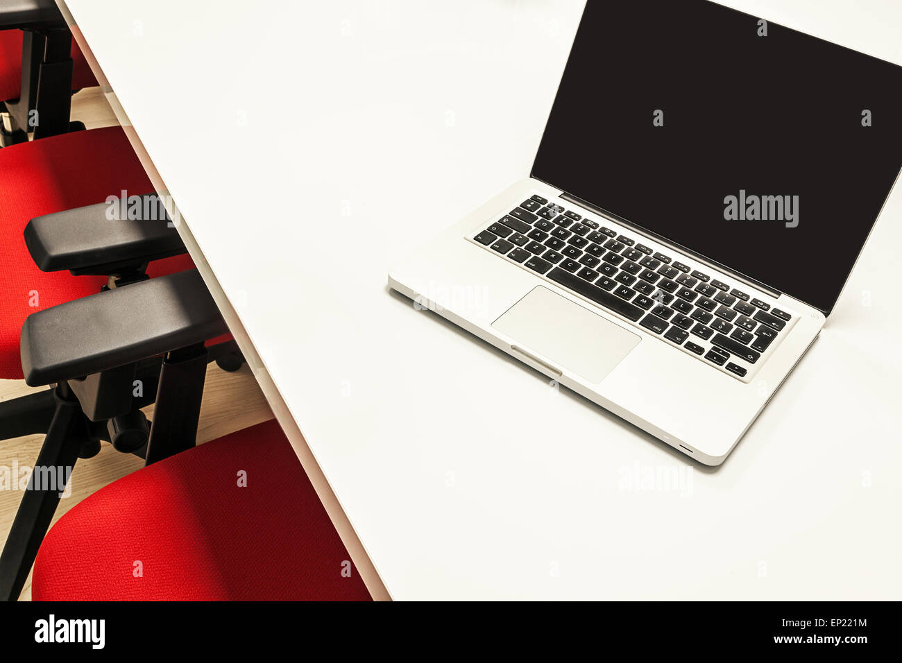 Modern laptop on white table, details of an office interior Stock Photo ...