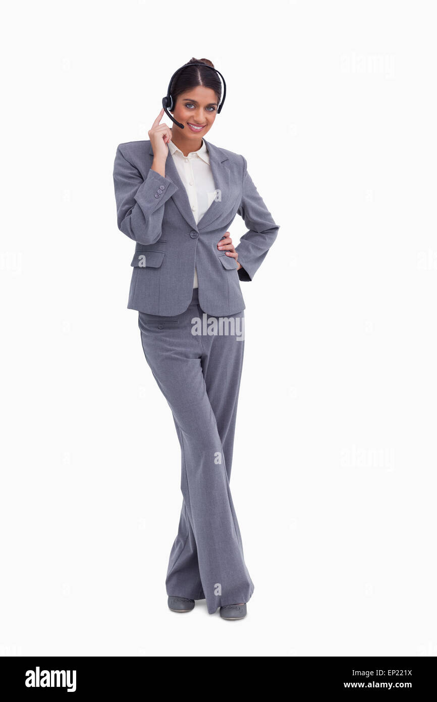 Smiling female call center agent with her legs crossed Stock Photo - Alamy