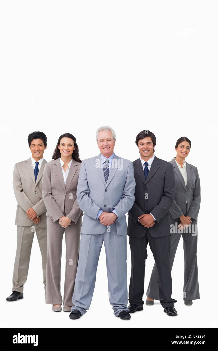 Smiling mature salesman standing together with his team Stock Photo - Alamy