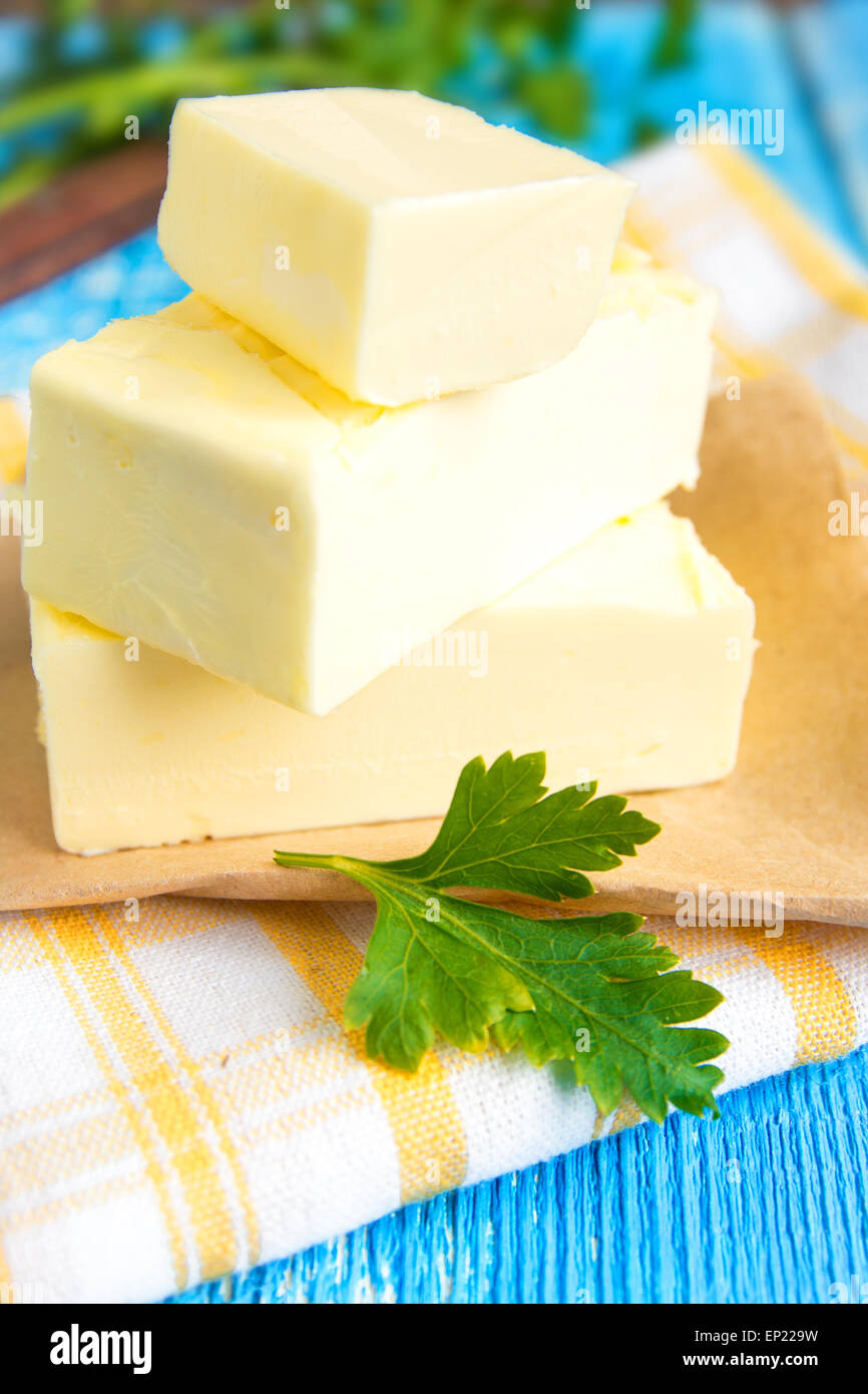 Butter over rustic blue wooden table Stock Photo - Alamy