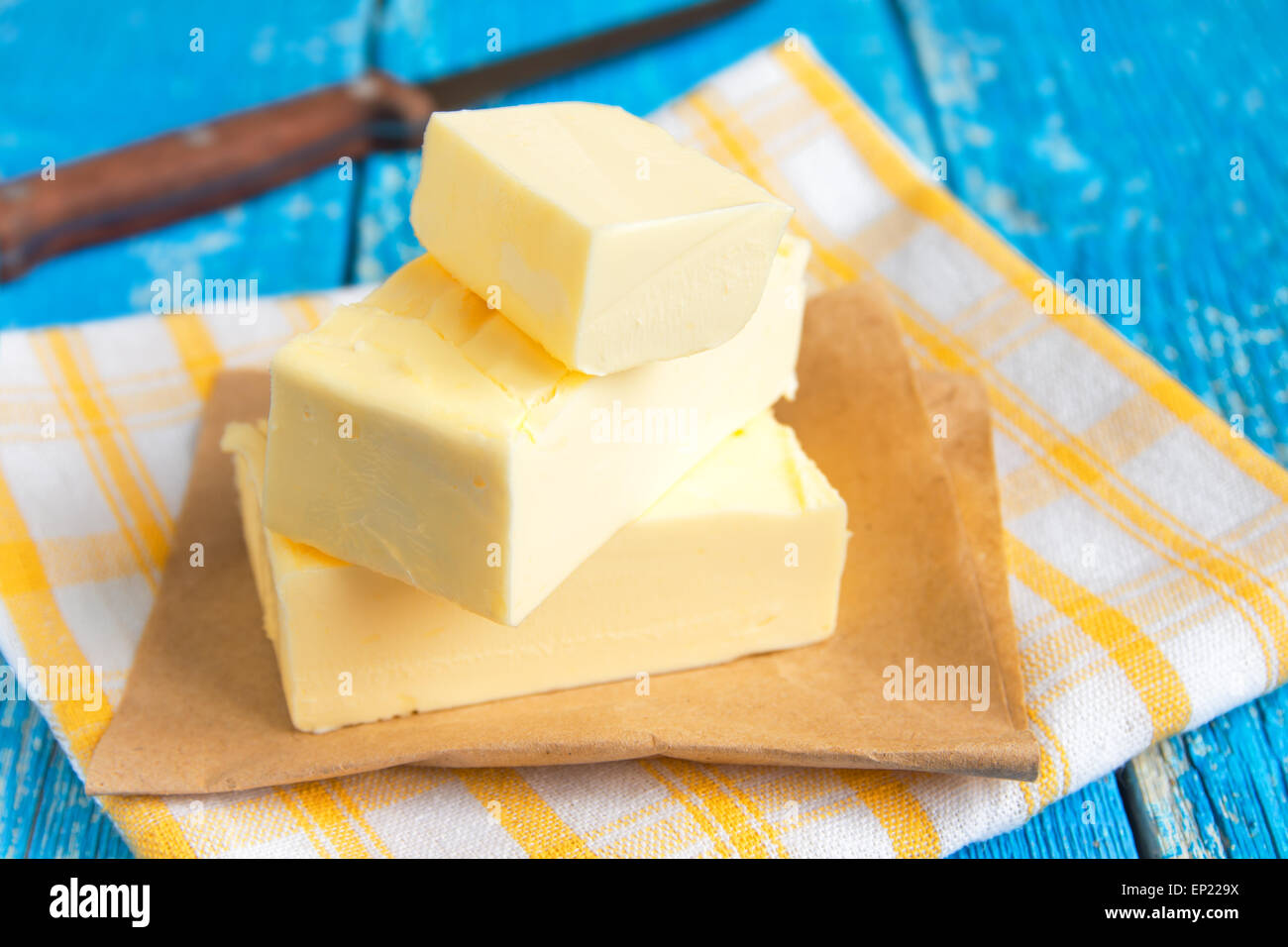 Butter over rustic blue wooden table Stock Photo - Alamy