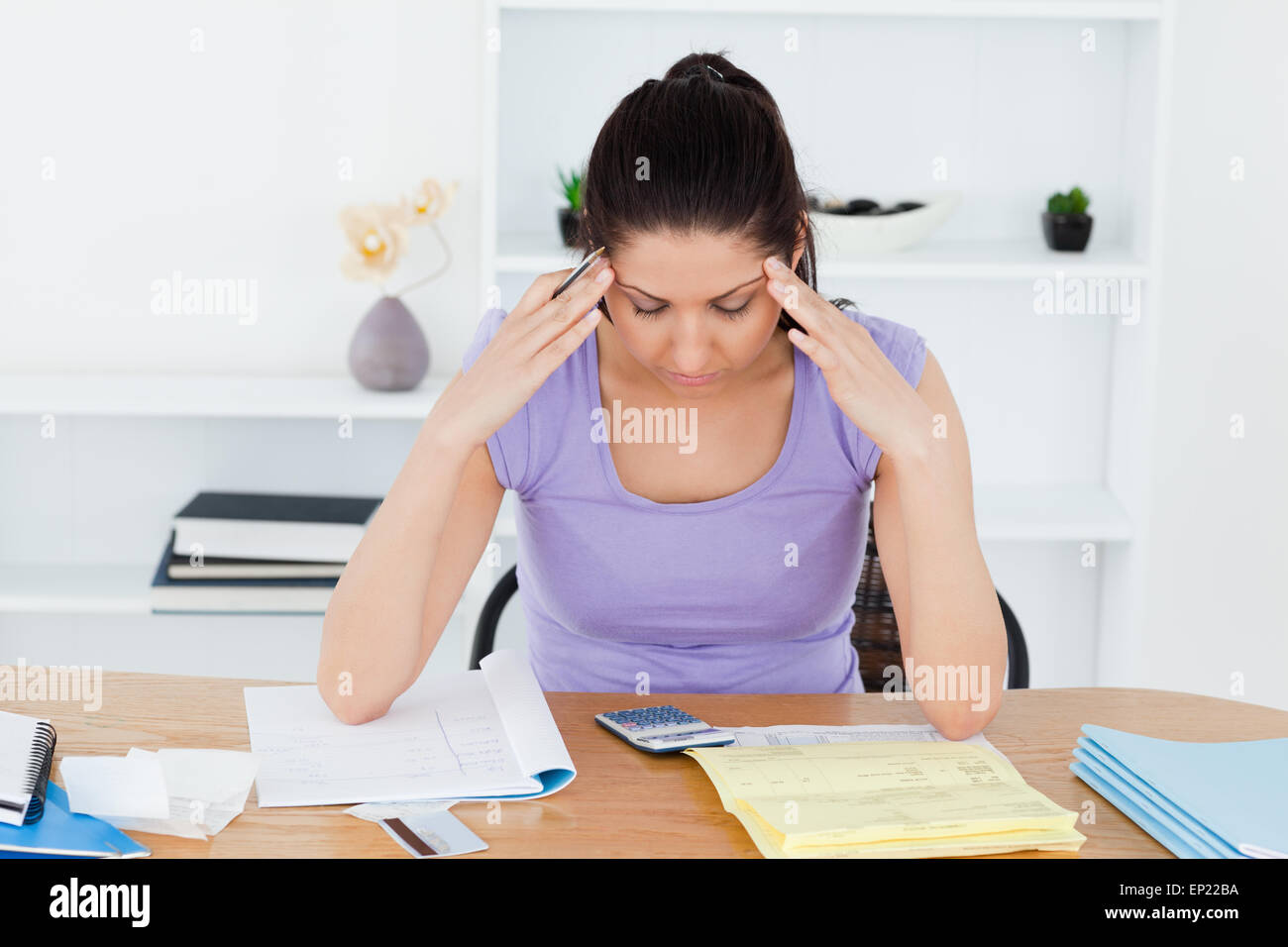 Stressed young woman accounting Stock Photo - Alamy