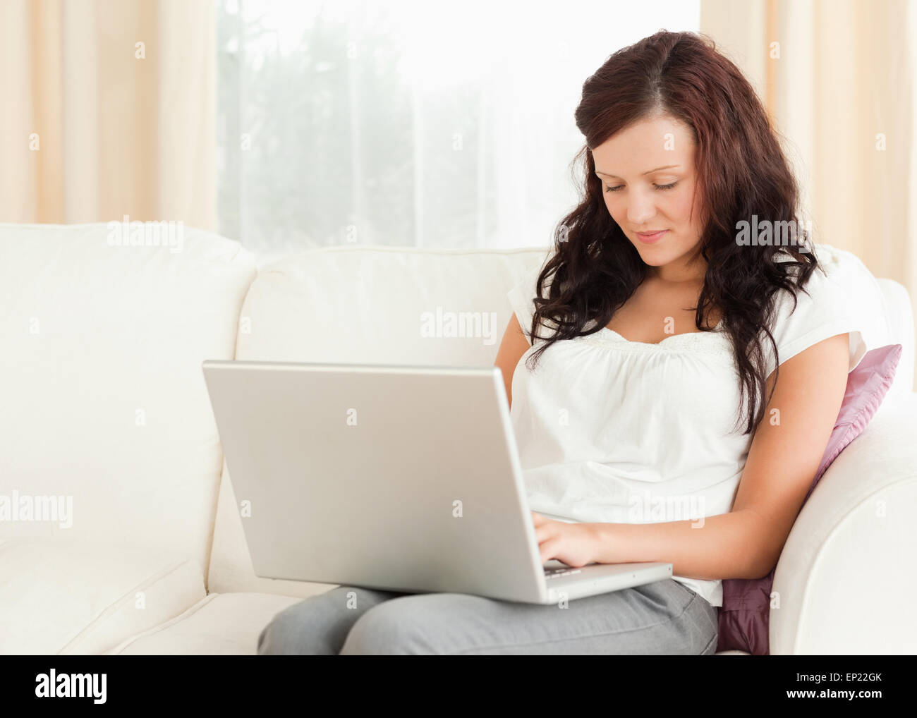 Young woman searching the internet Stock Photo - Alamy