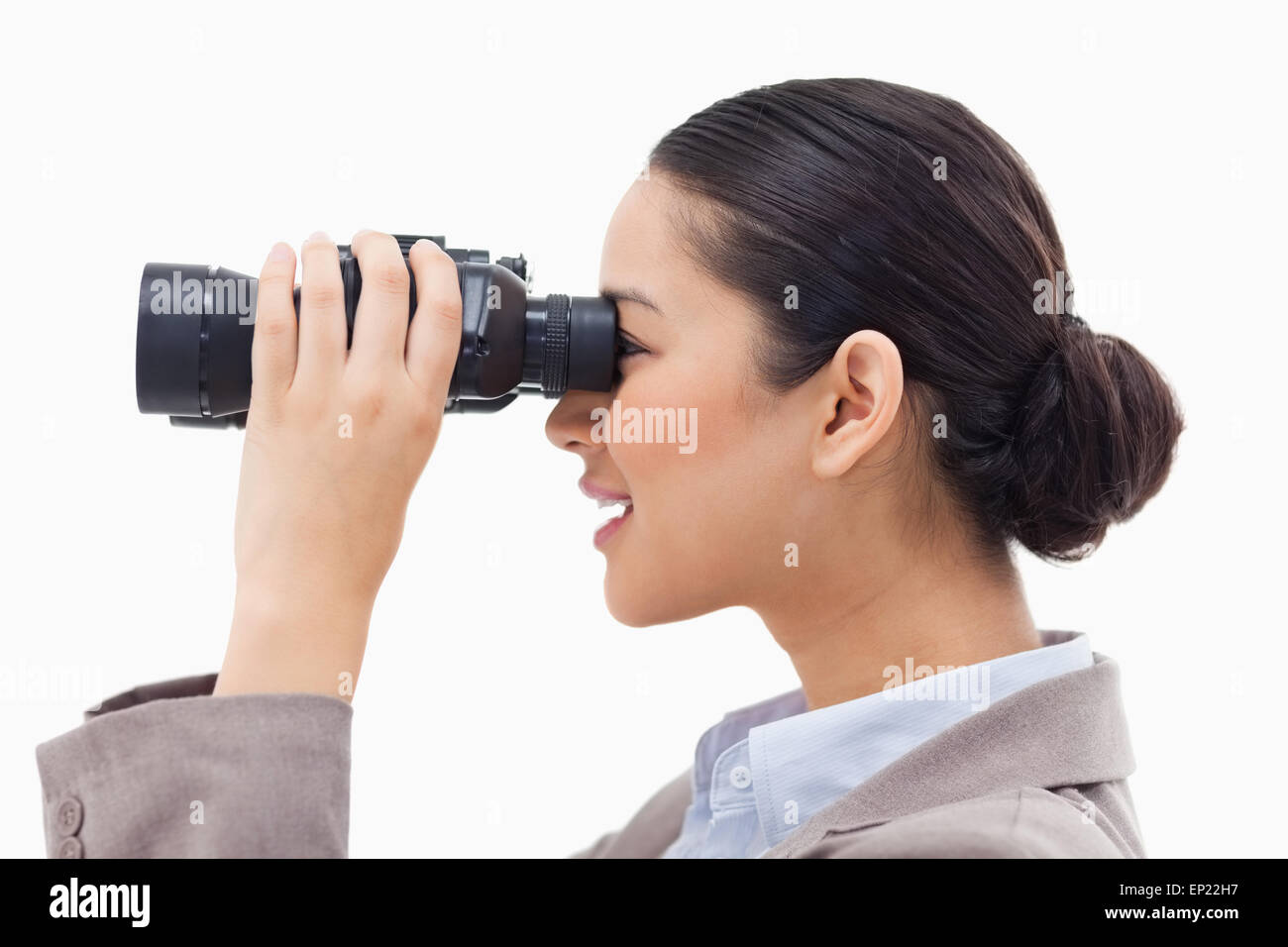 Side view of a businesswoman looking through binoculars Stock Photo - Alamy