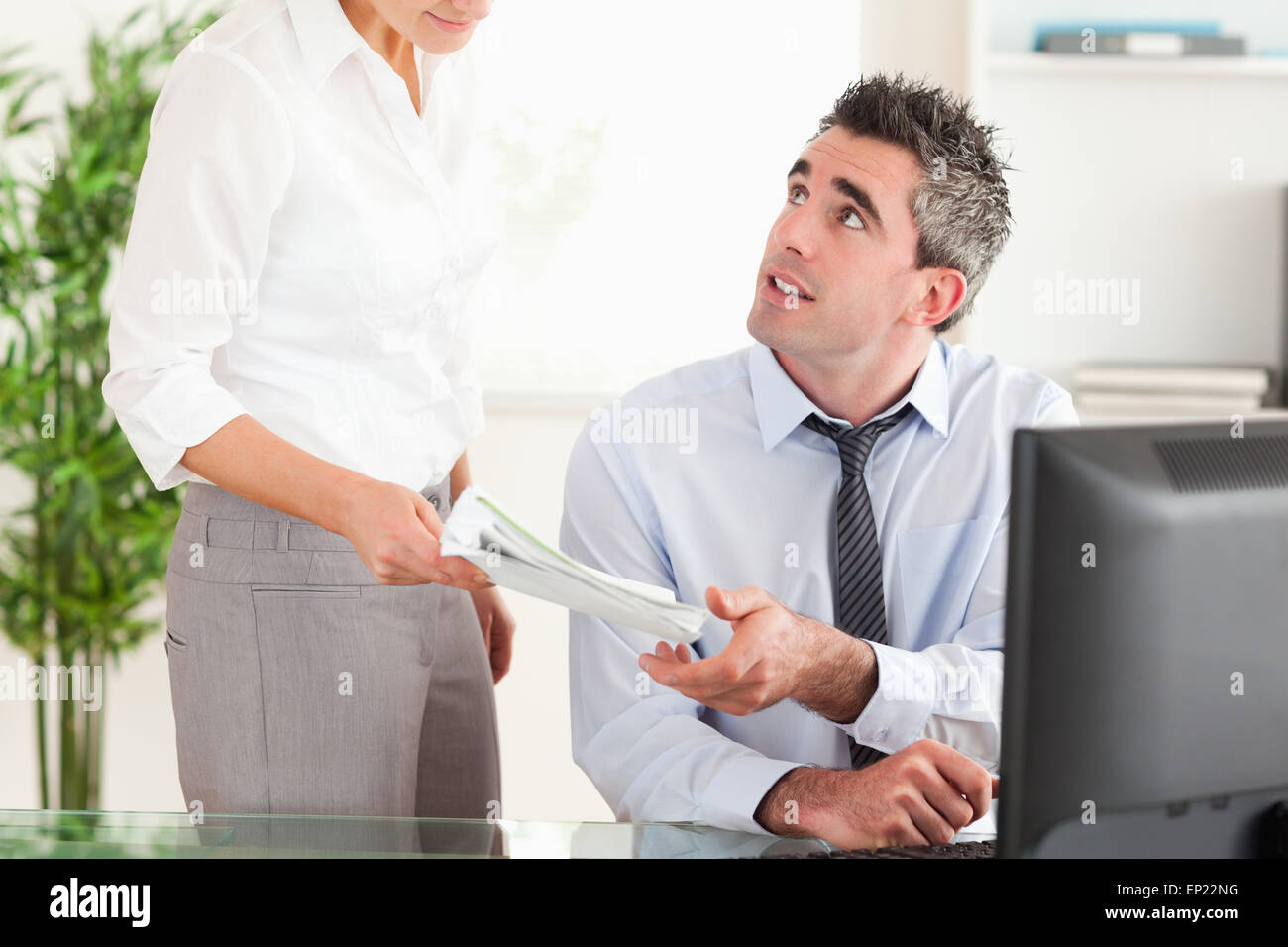 Business manager receiving a document from his secretary Stock Photo ...