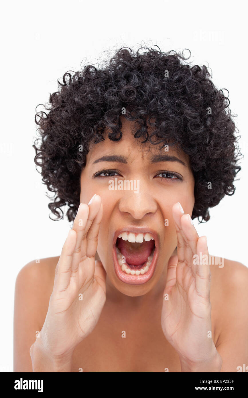 Teenager shouting very loudly against a white background Stock Photo ...
