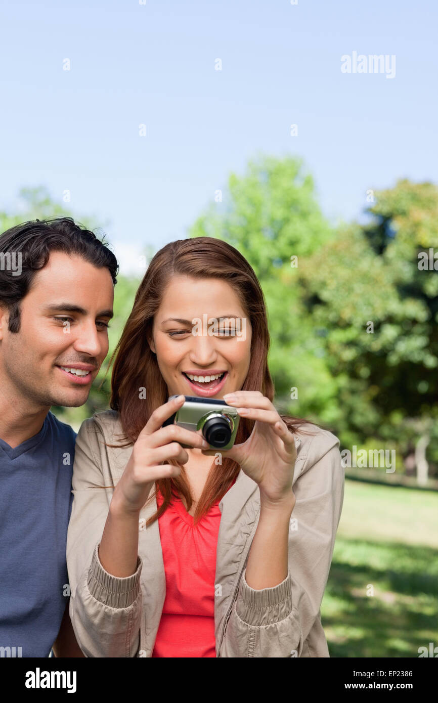 Two friends looking at the photo collection in her camera Stock Photo ...