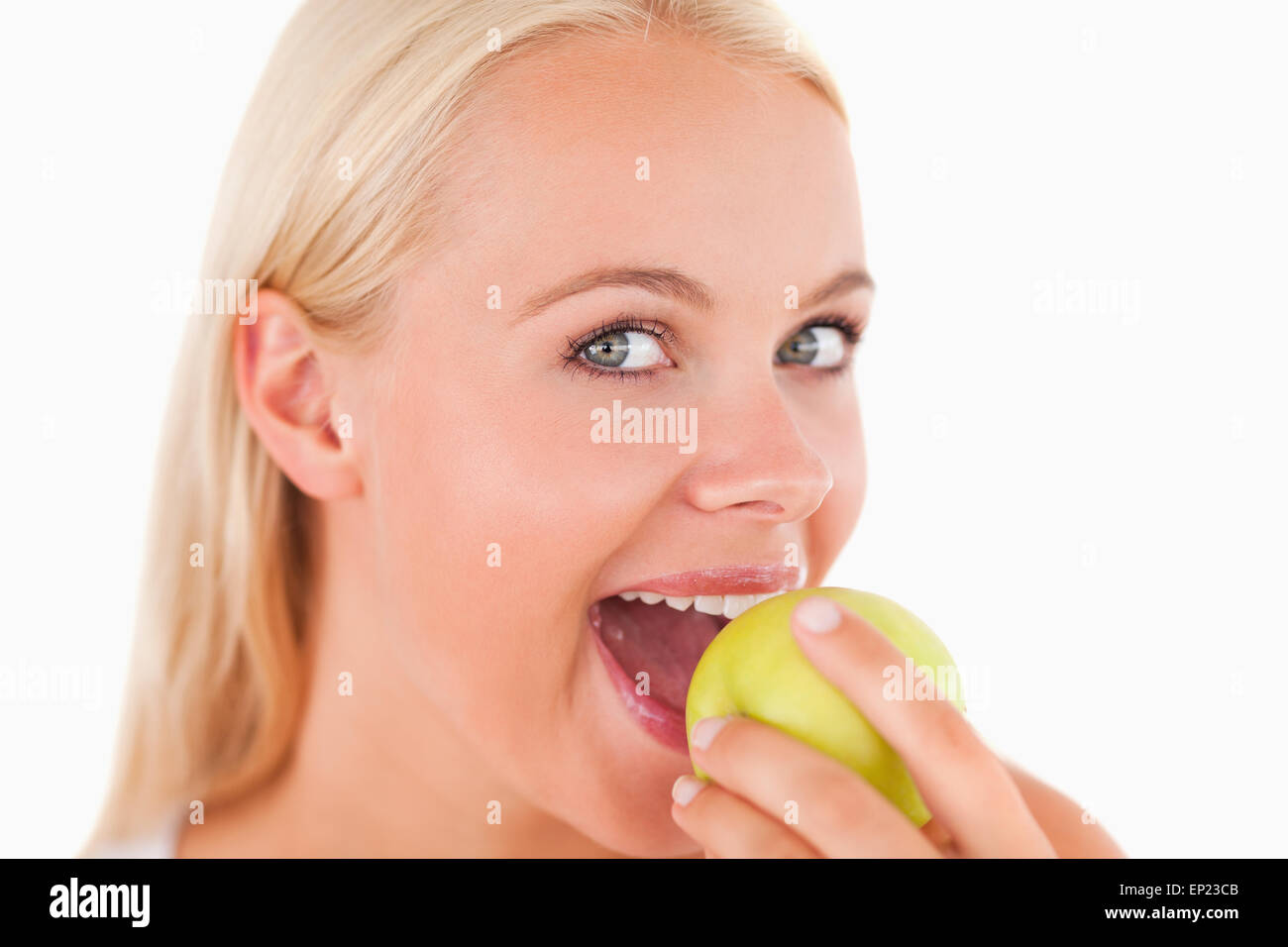 Woman eating an apple Stock Photo - Alamy