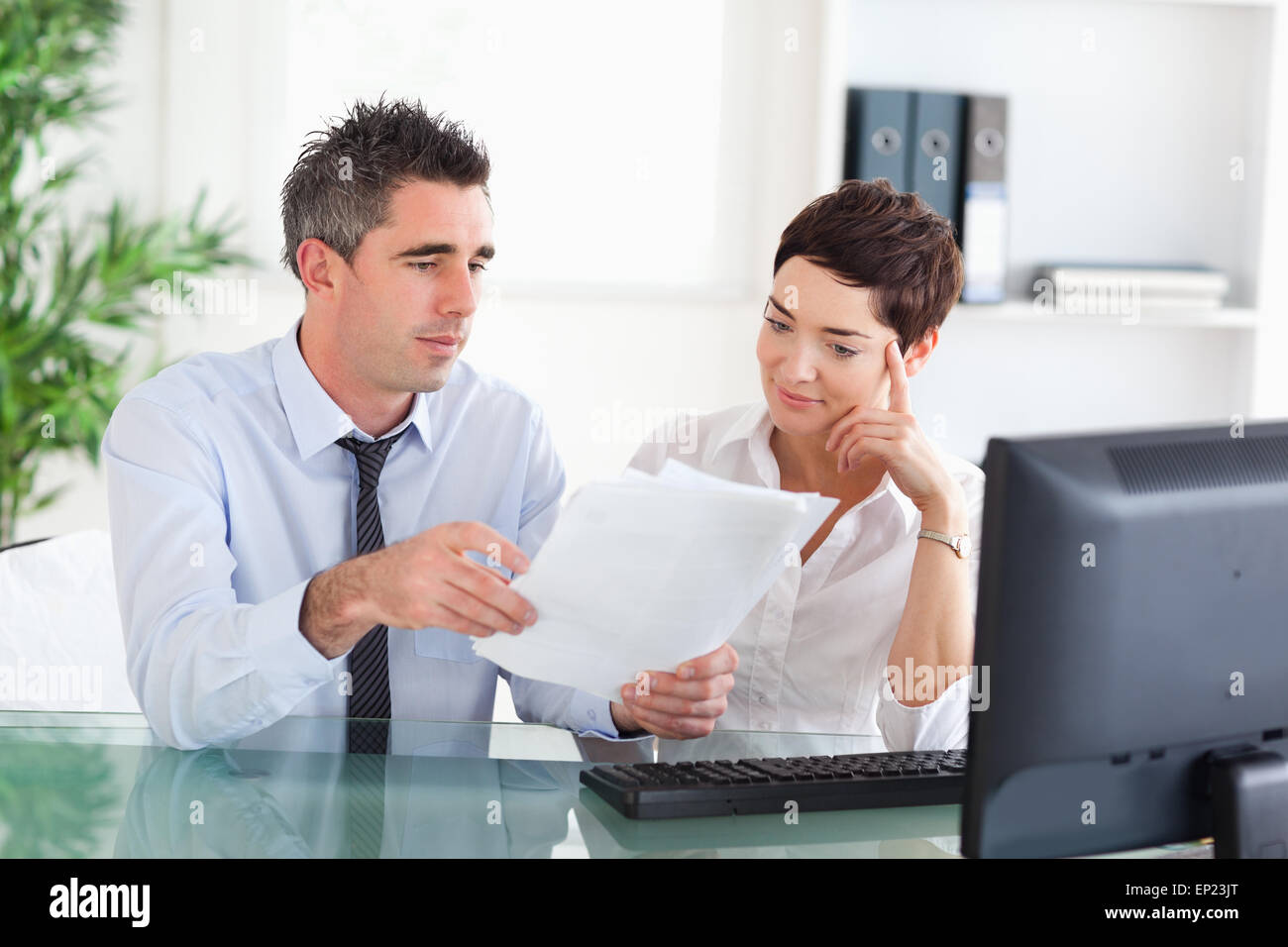 Manager and his secretary reading a blueprint document Stock Photo - Alamy