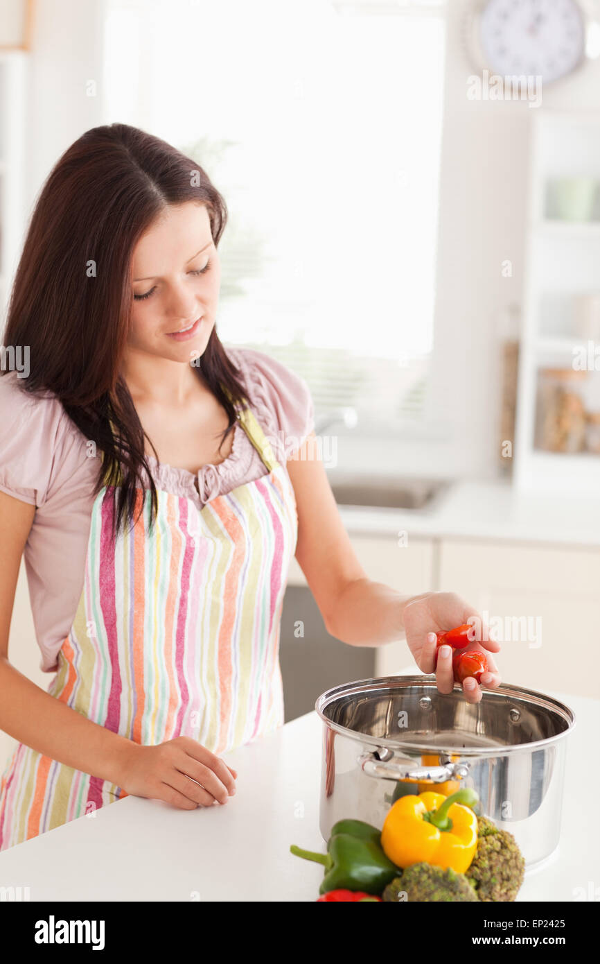 Woman cooking in kitchen Stock Photo - Alamy