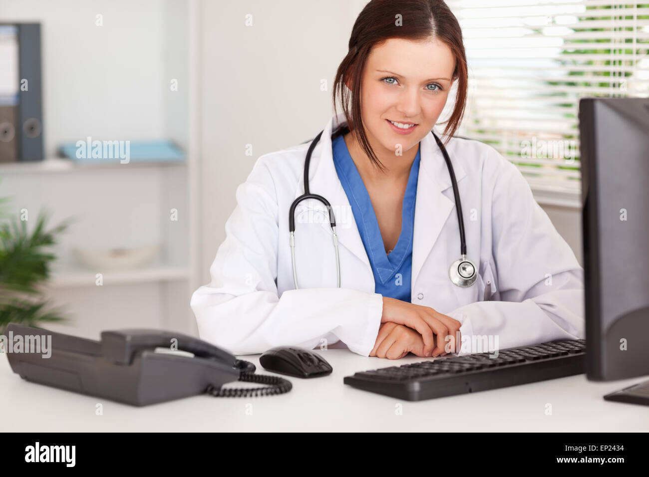Female doctor in office Stock Photo - Alamy