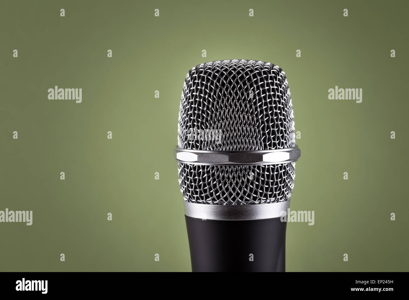 Wireless microphone closeup on green background Stock Photo - Alamy