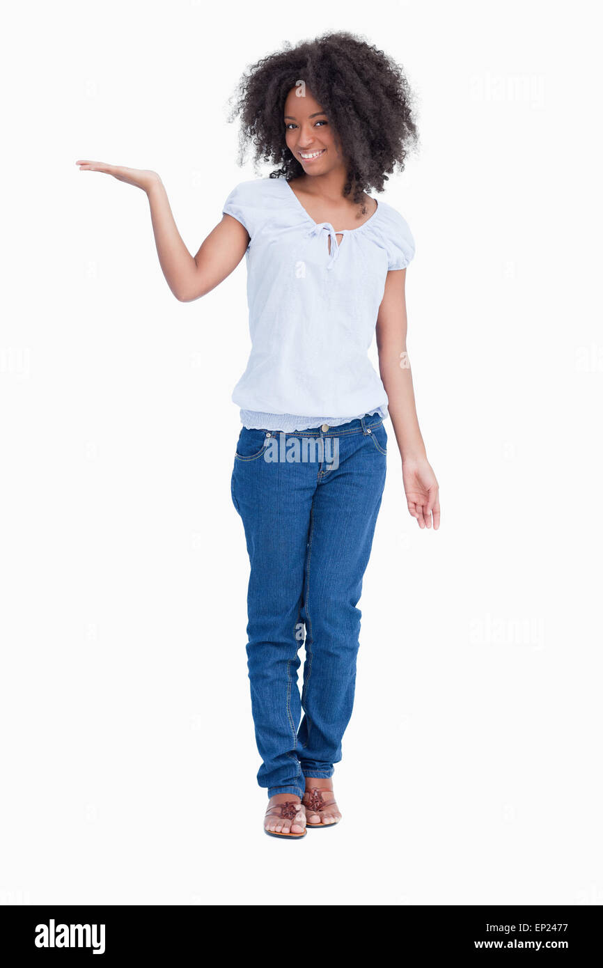 Young smiling woman putting her hand palm up Stock Photo - Alamy