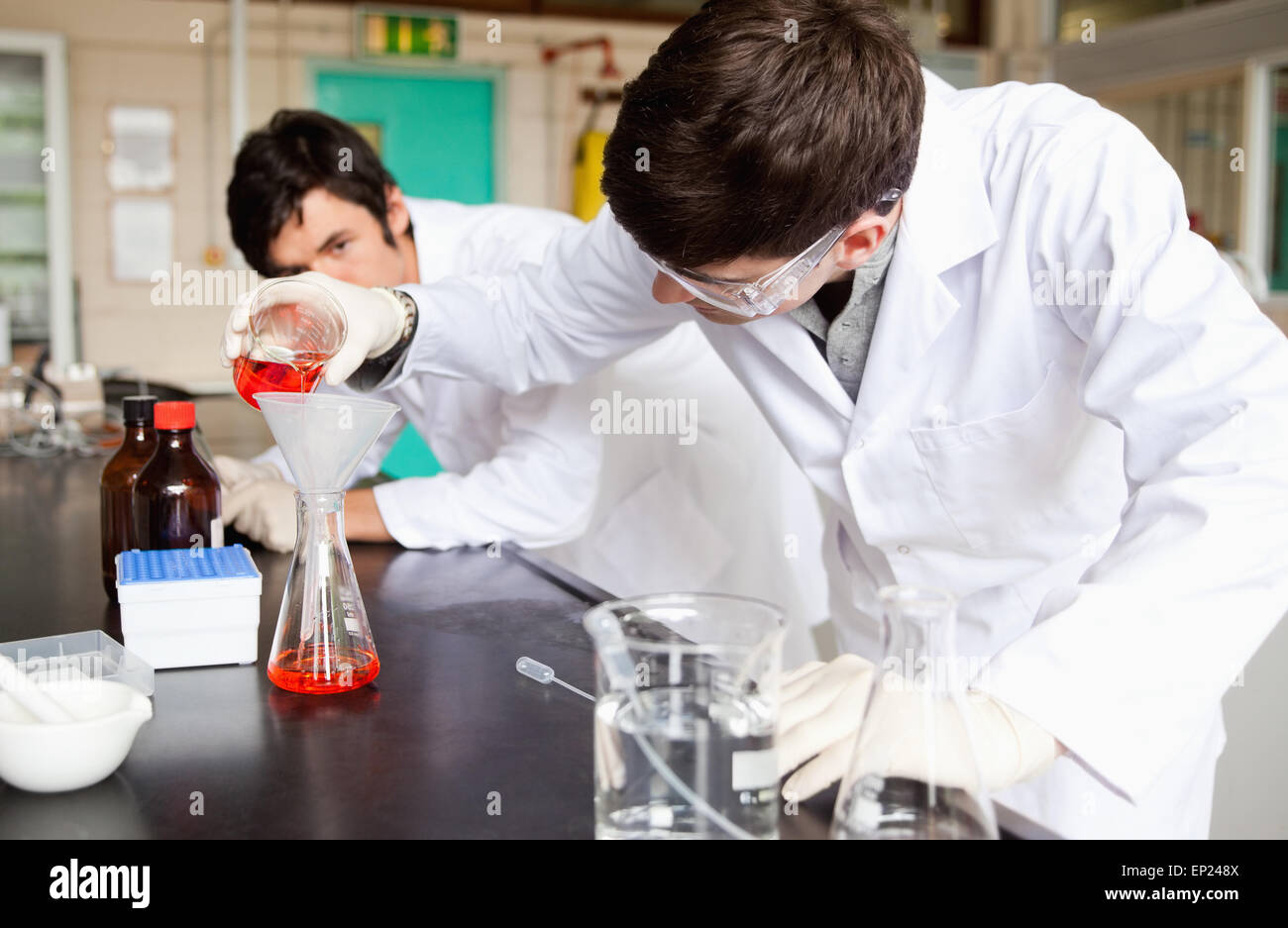 Students making an experiment Stock Photo - Alamy