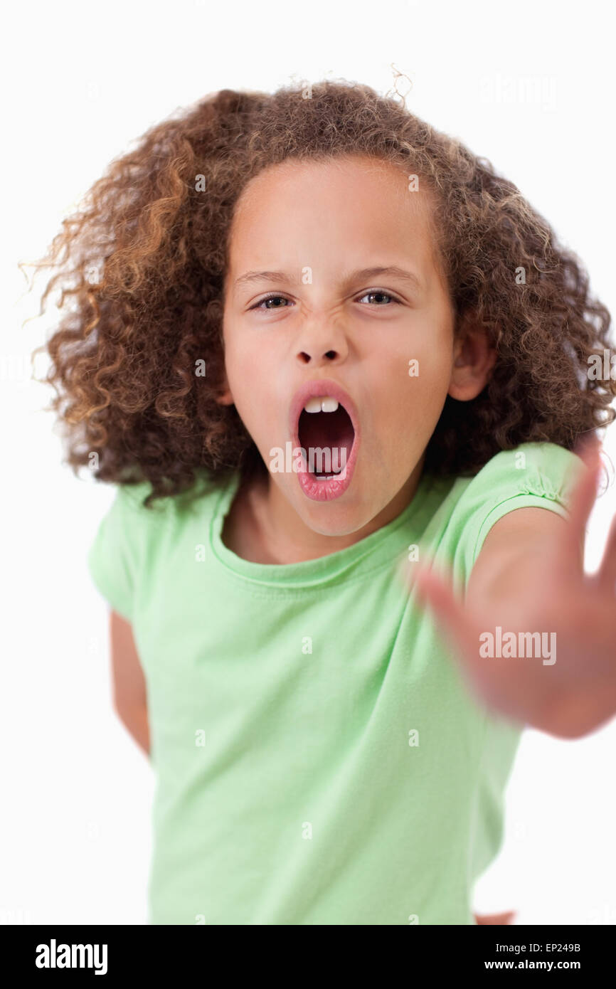 Portrait of an angry girl saying stop with her hand Stock Photo - Alamy