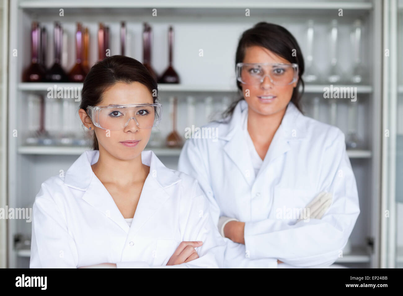 Serious female scientists posing Stock Photo - Alamy