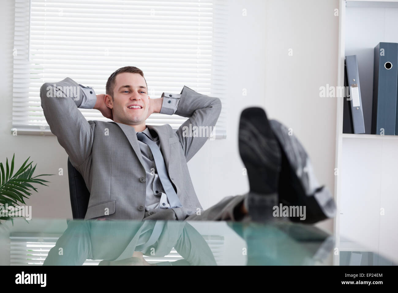 Smiling businessman taking a break Stock Photo - Alamy