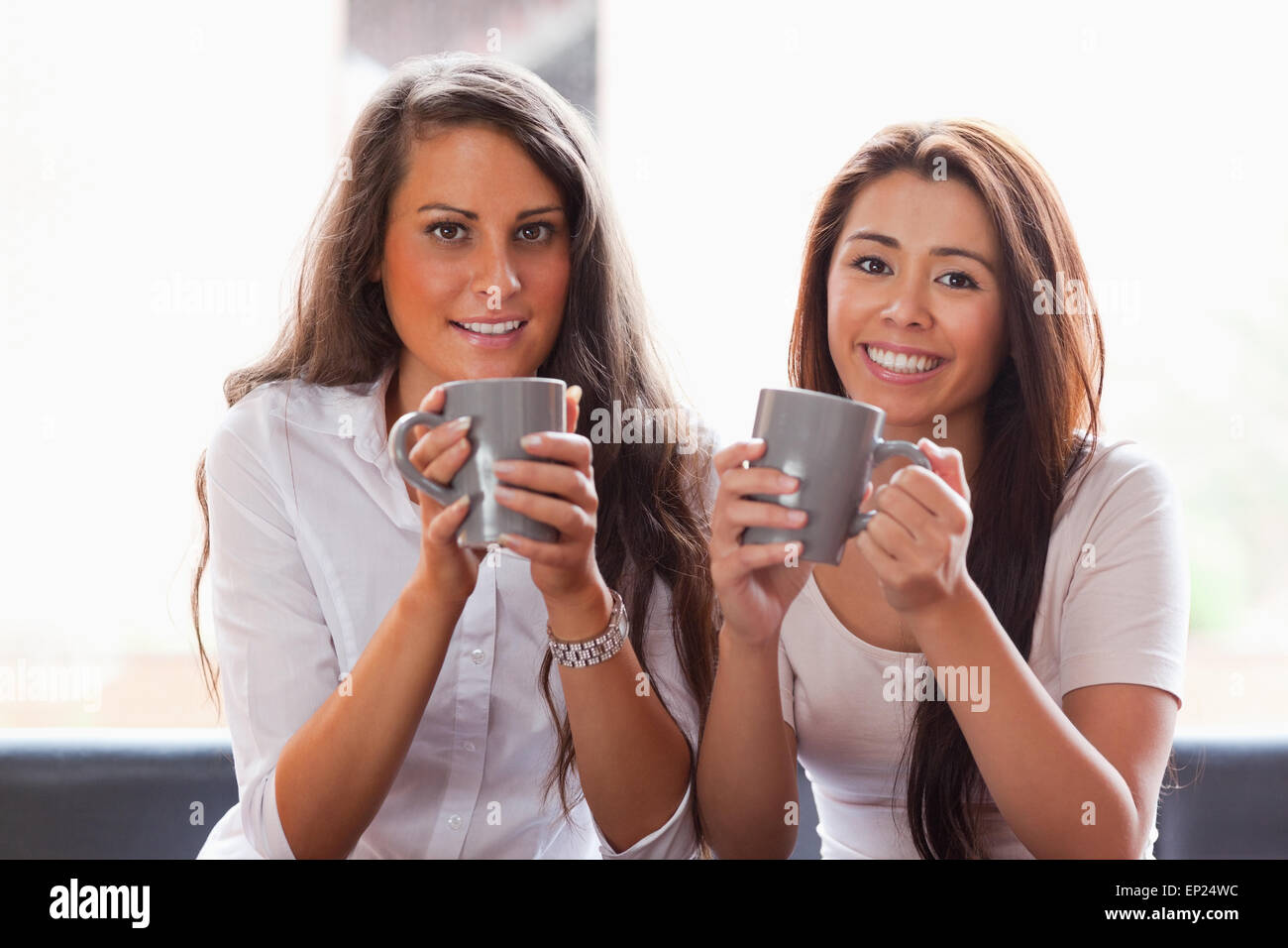 Friends having a cup of coffee Stock Photo - Alamy